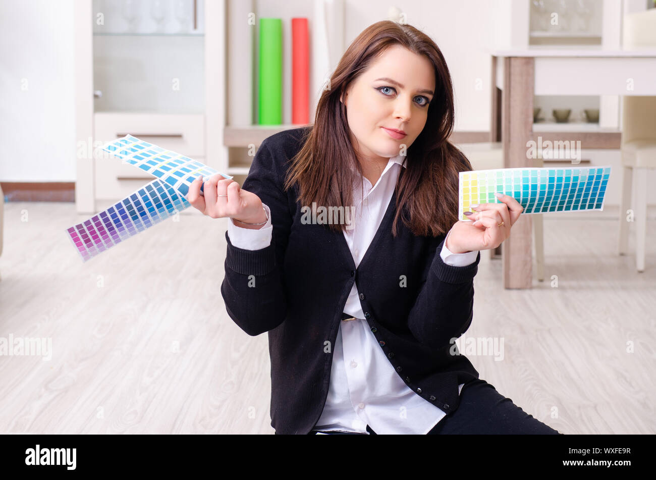 Female designer working in the office Stock Photo - Alamy