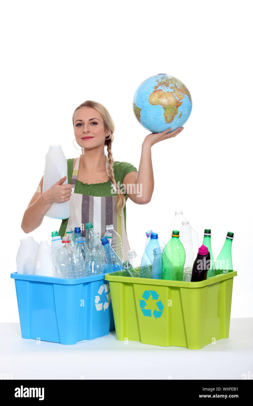 Woman recycling plastic bottles to protect planet earth Stock Photo - Alamy