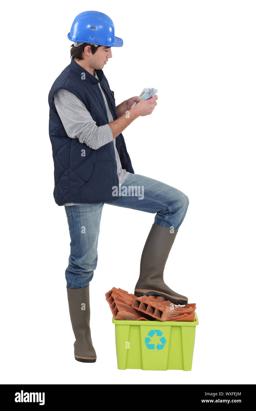 Worker counting money Stock Photo - Alamy