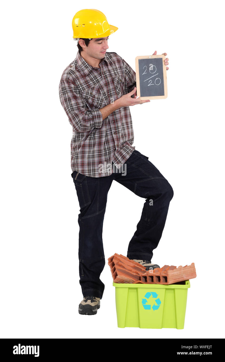 Top marks for a builder recycling material Stock Photo - Alamy