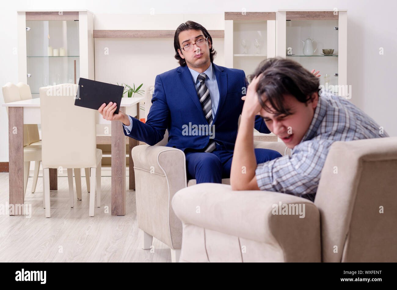 Young male patient discussing with psychologist personal problem Stock ...