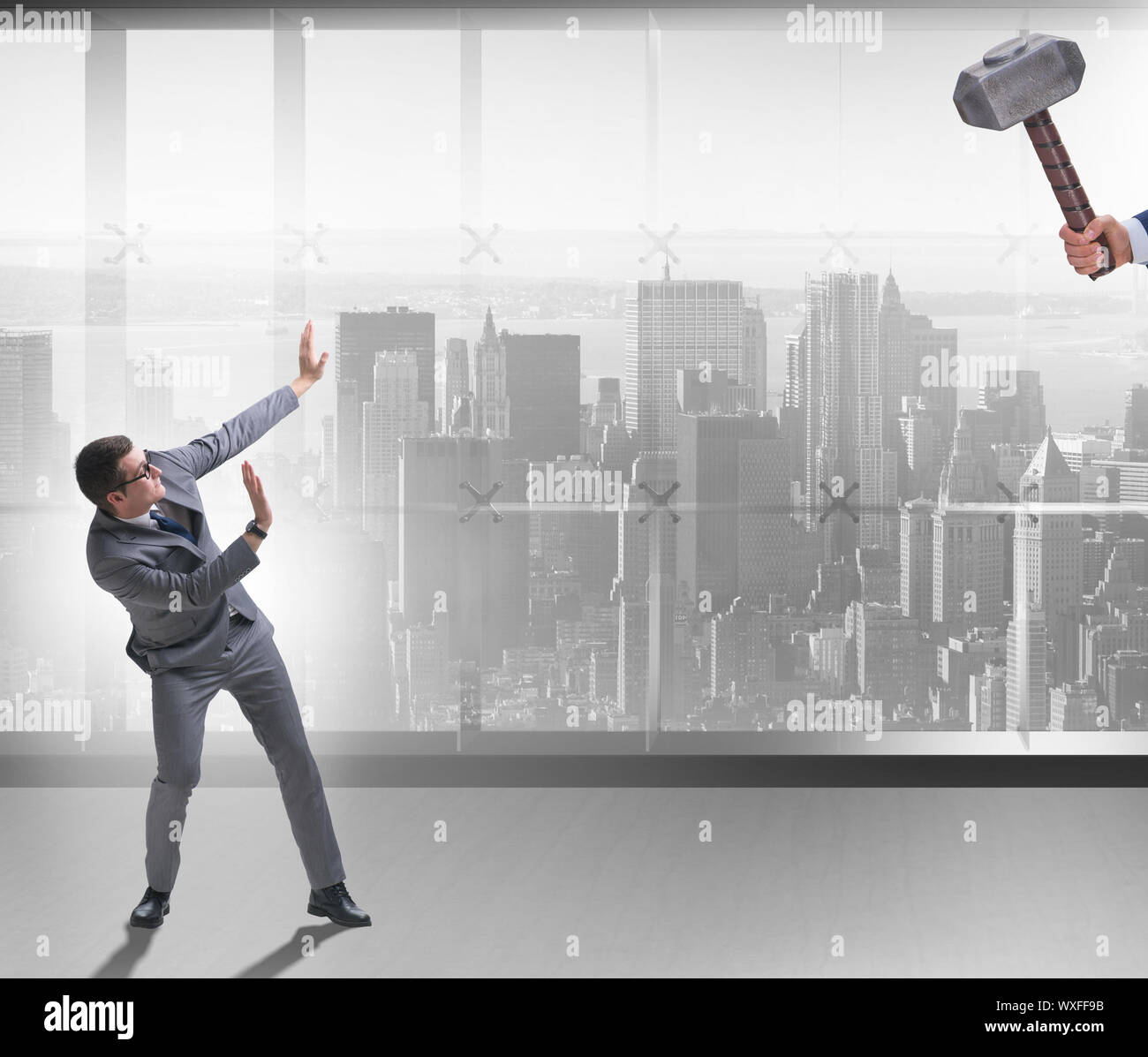 Bad angry boss threatening employee with hammer Stock Photo - Alamy