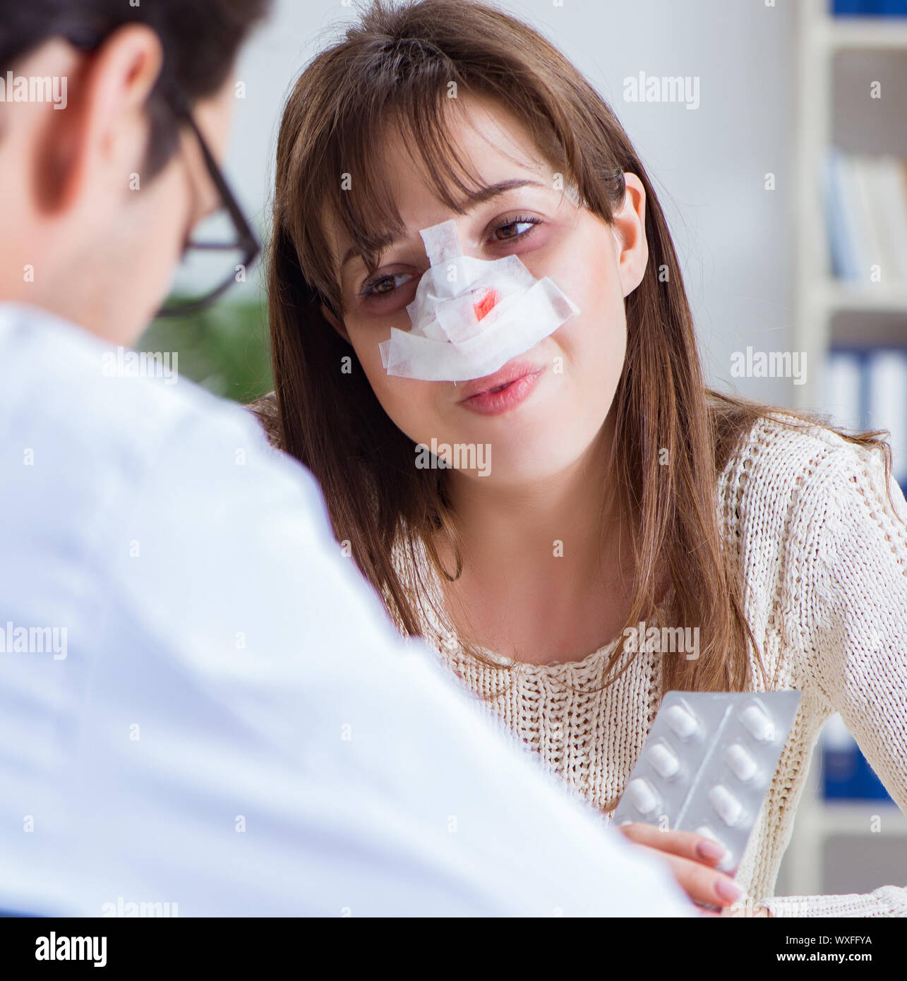 Male doctor talking to patient with nose operation surgery Stock Photo ...