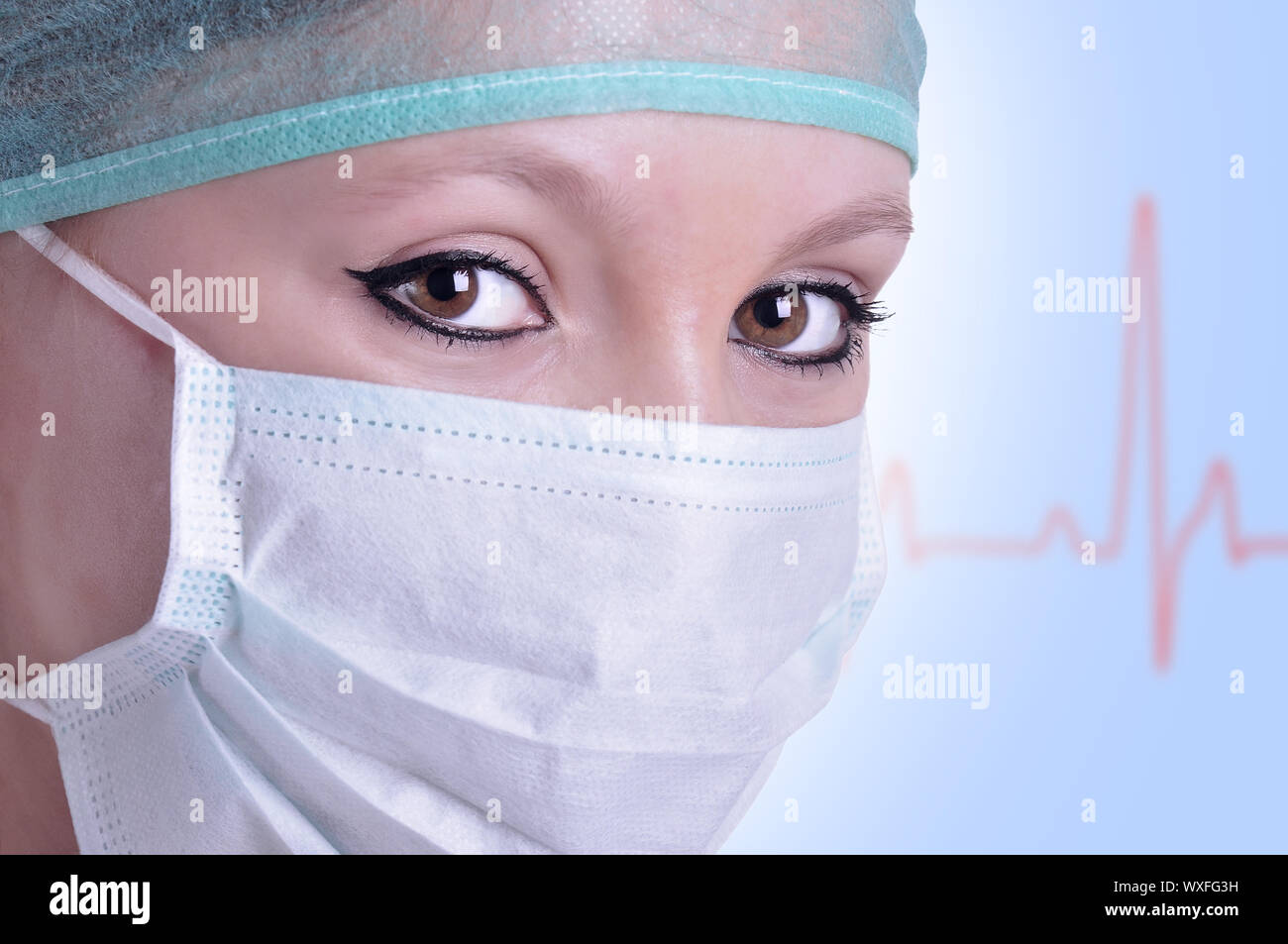 Closeup portrait of a female surgeon with an EKG graph behing her, with ...