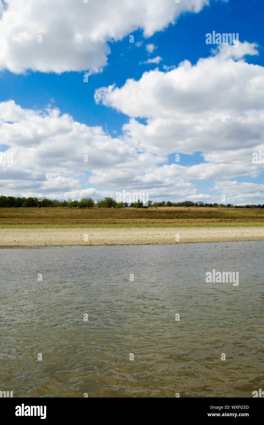 white clouds above beautiful bent steppe river Stock Photo - Alamy