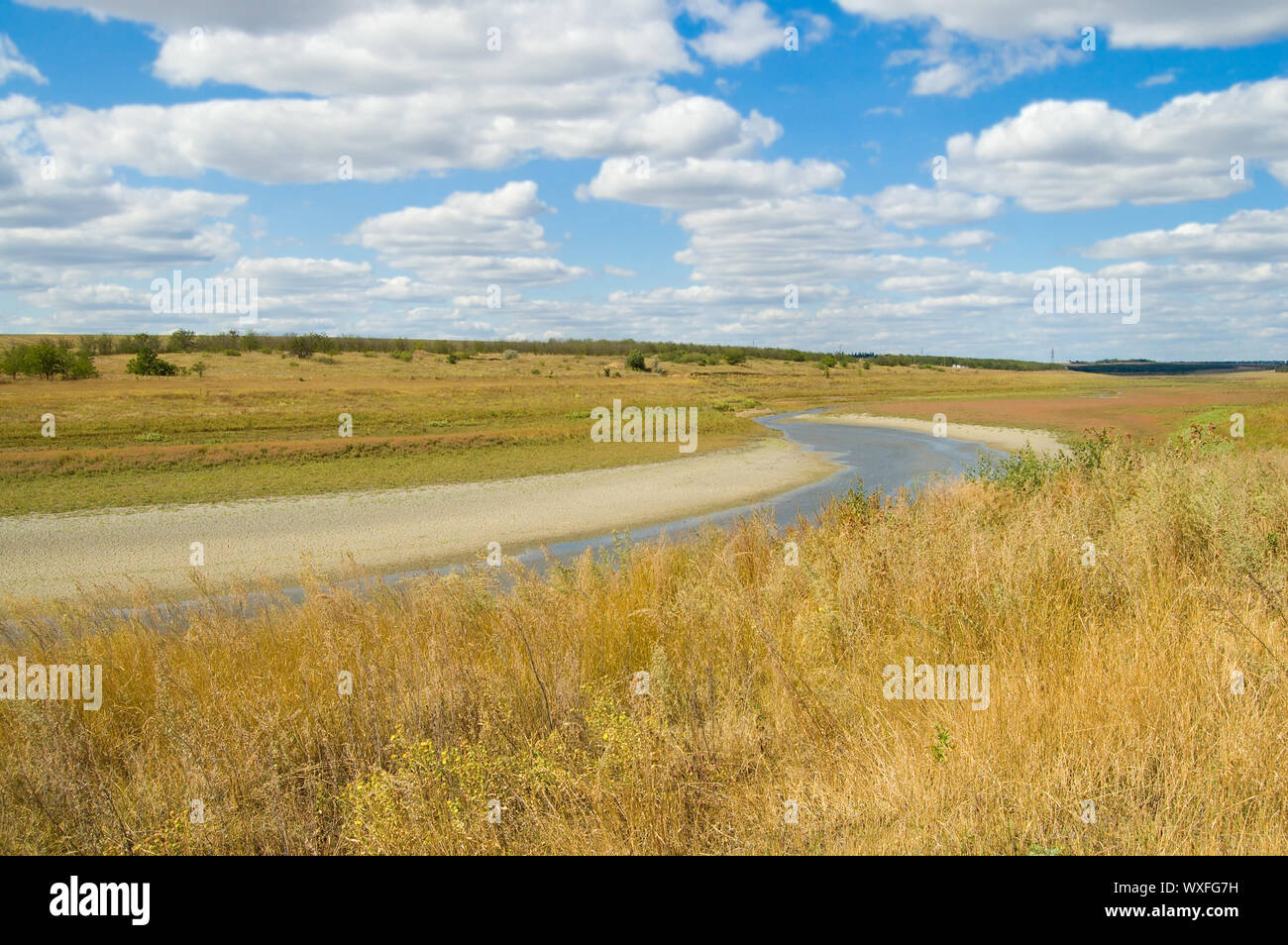 river in steppe with clouds in the sky Stock Photo - Alamy