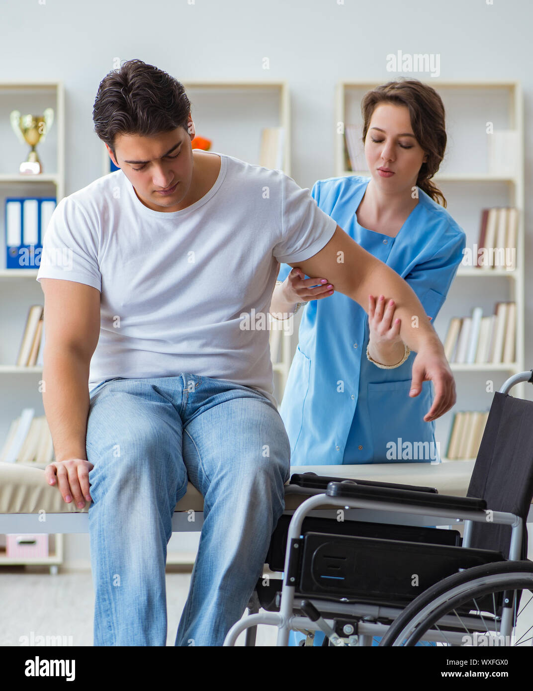 Patient undergoing rehabilitation recovery programme with doctor Stock ...