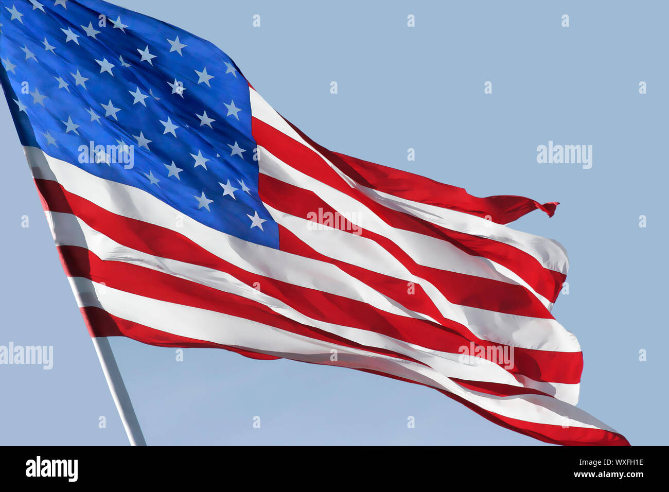 Beautiful USA Flag waving in the wind with bright natural sunlight ...
