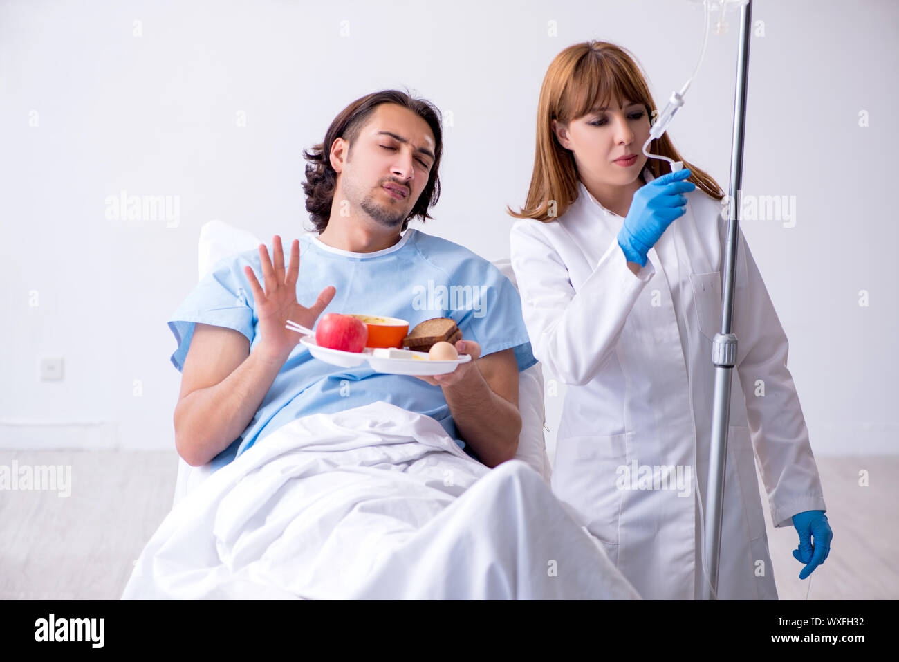 Male patient eating food in the hospital Stock Photo - Alamy