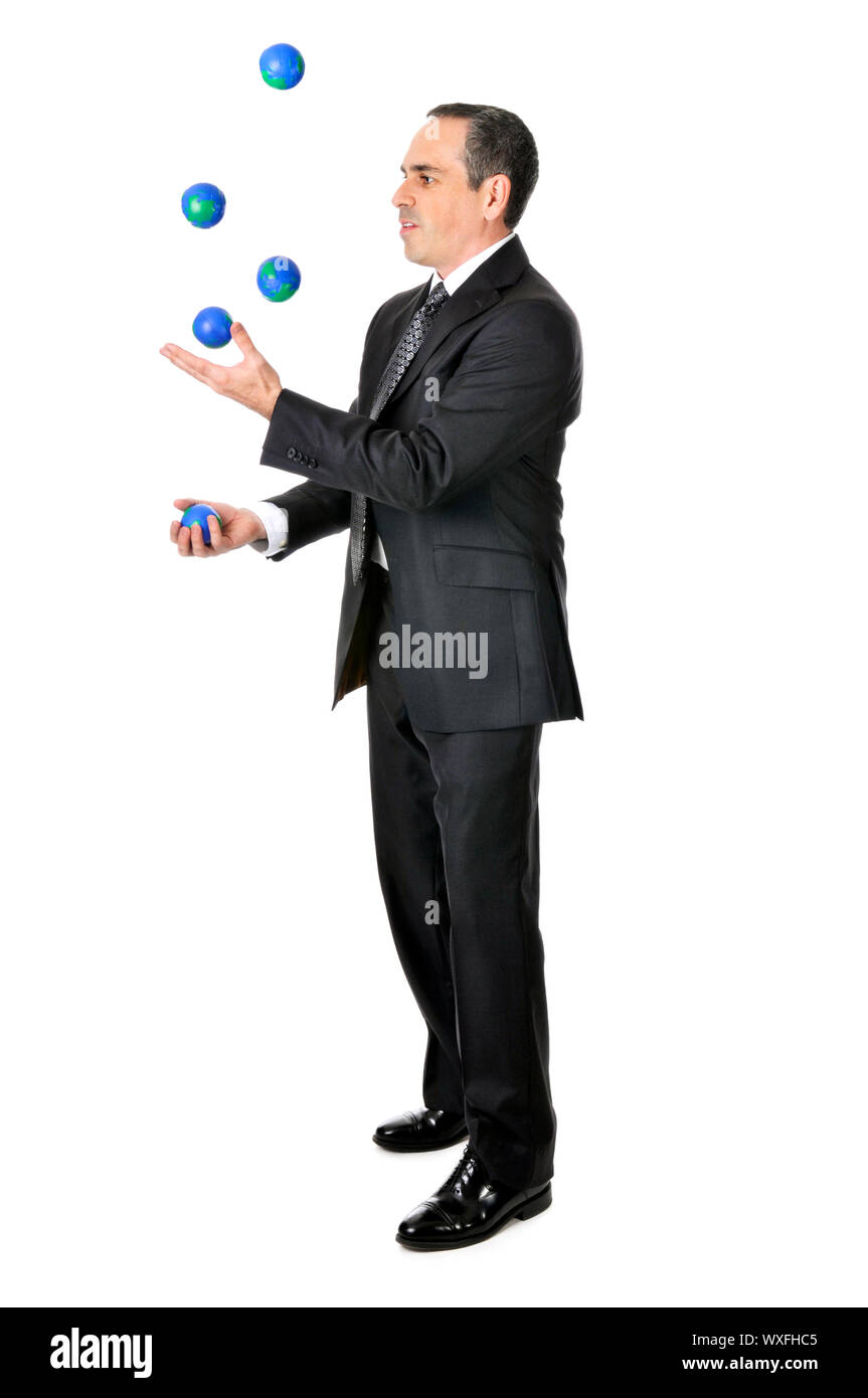 Business man in suit juggling planet earth balls Stock Photo - Alamy