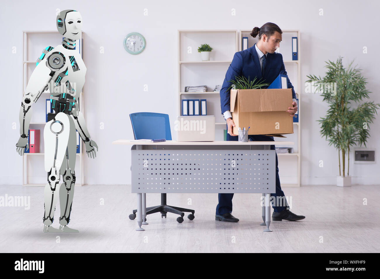 Concept of robots replacing humans in offices Stock Photo - Alamy