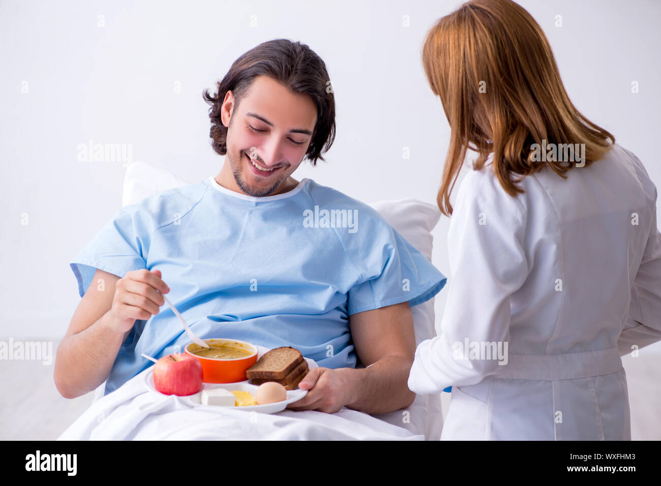 Male patient eating food in the hospital Stock Photo - Alamy