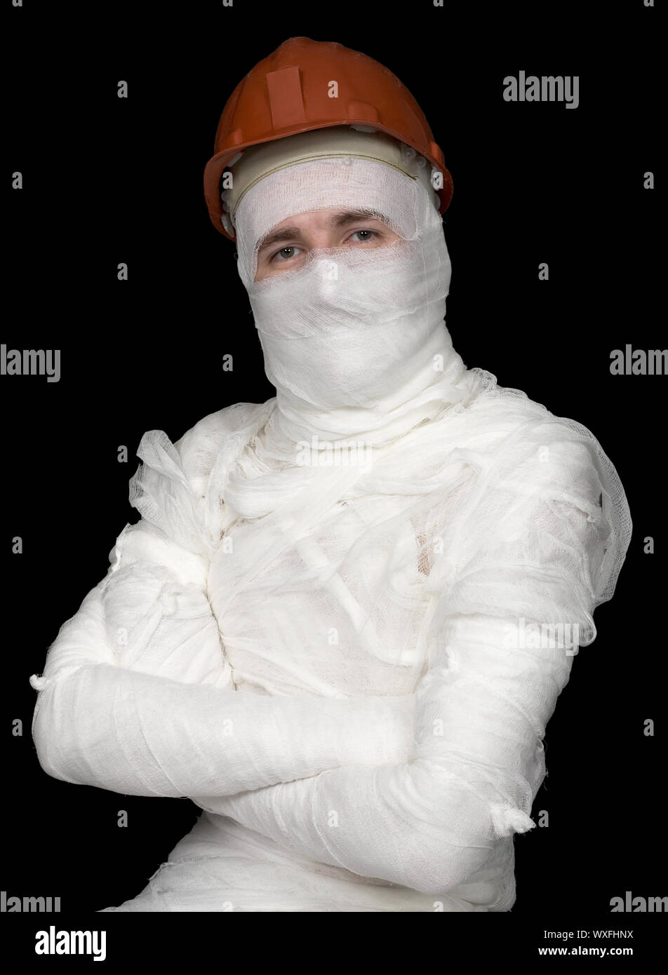 Guy in bandage with the helmet on black Stock Photo - Alamy