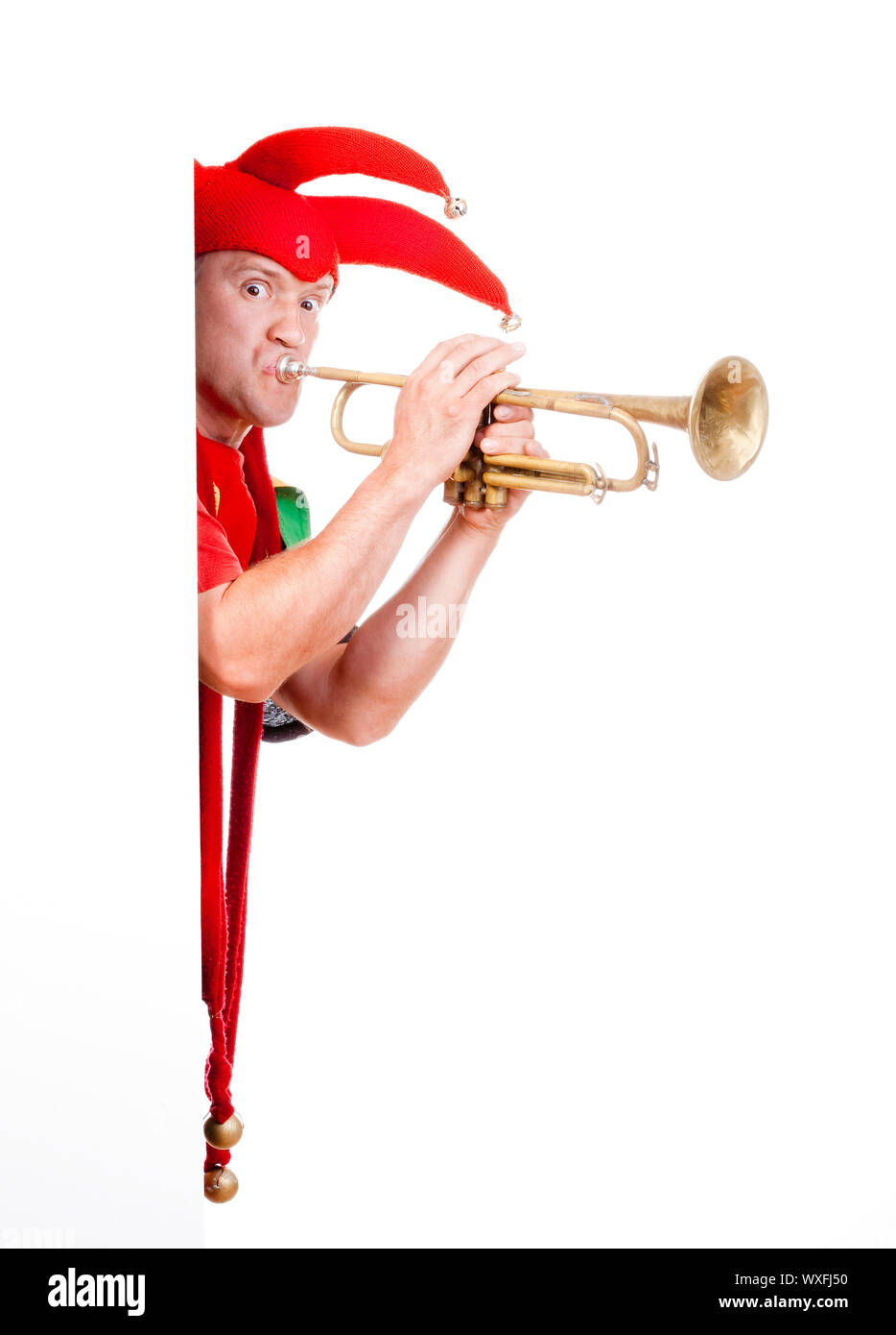 jester - entertaining figure in typical costume blowing trumpet Stock ...