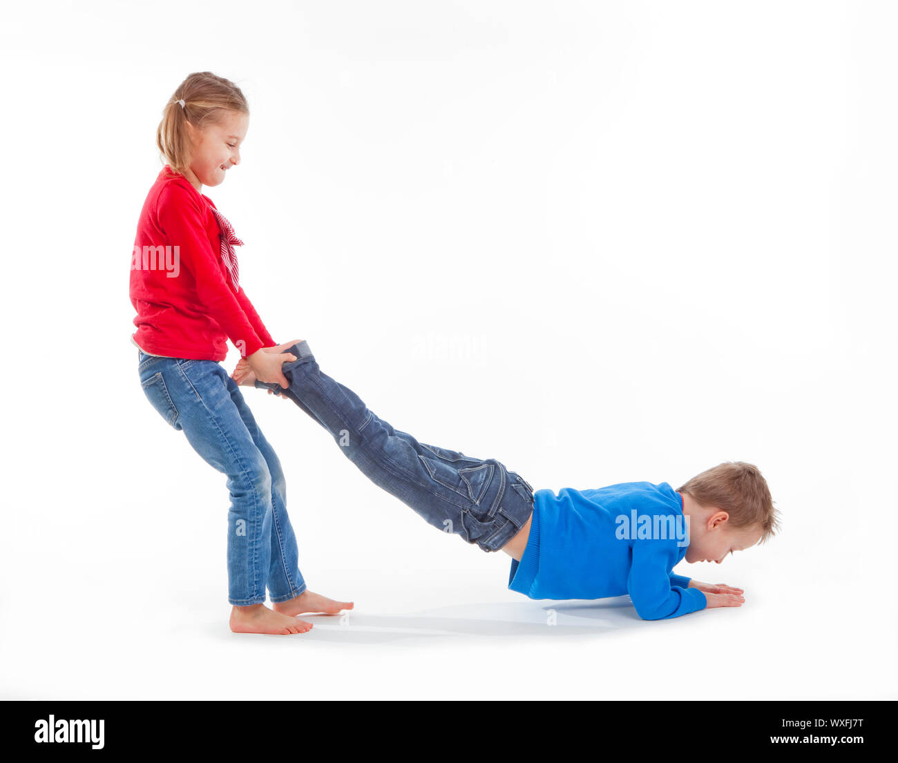 brother and sister having fun with each other - isolated on white Stock ...