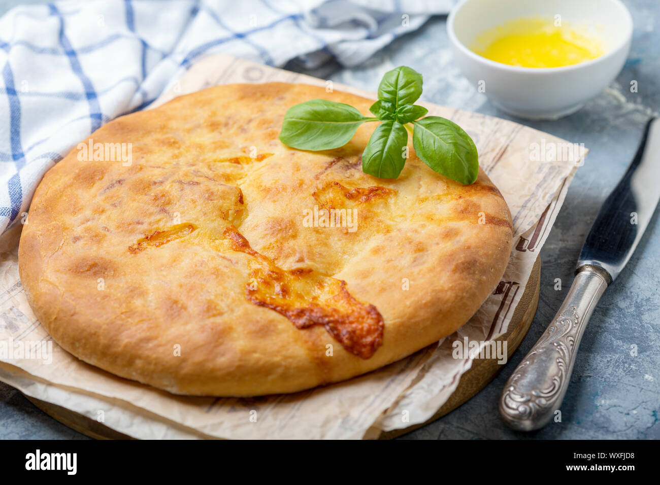 Traditional Georgian closed pie with cheese Stock Photo - Alamy