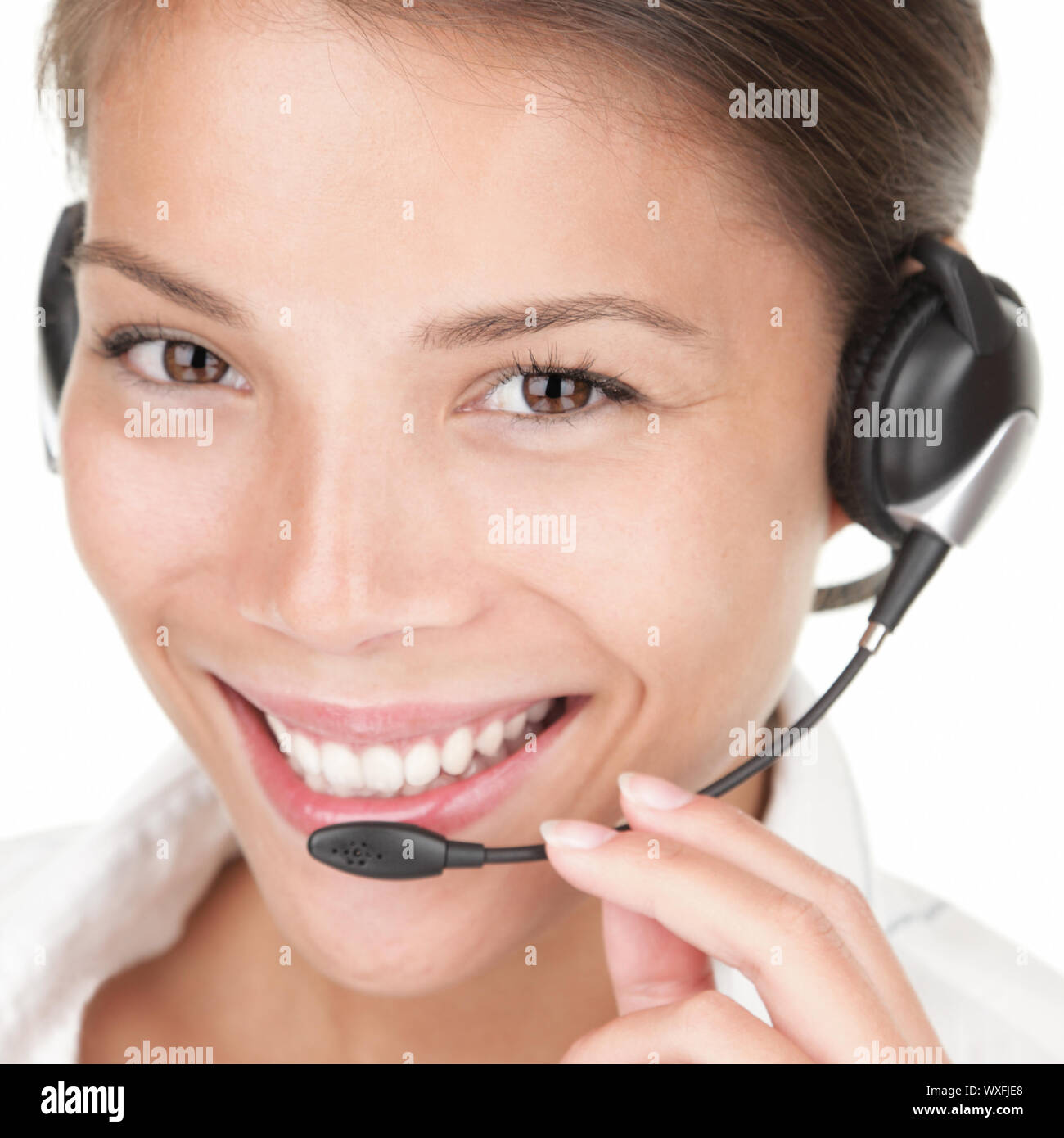 Telemarketing woman wearing headset on white background Stock Photo - Alamy