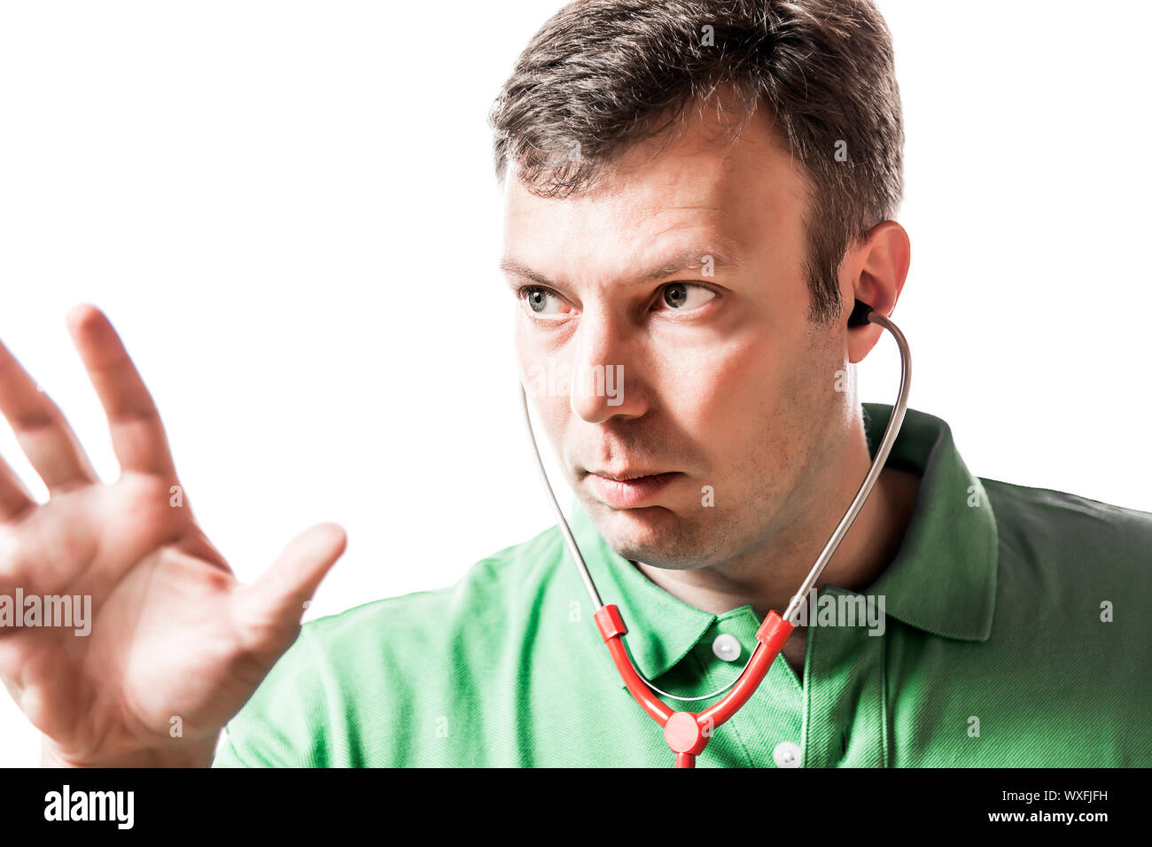 Male doctor in green shirt hi-res stock photography and images - Alamy
