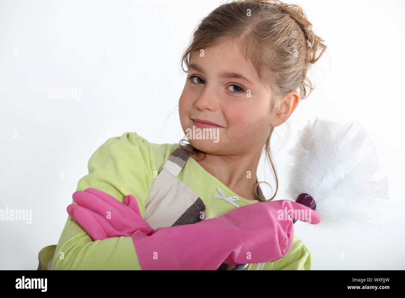 Little girl dusting Stock Photo - Alamy