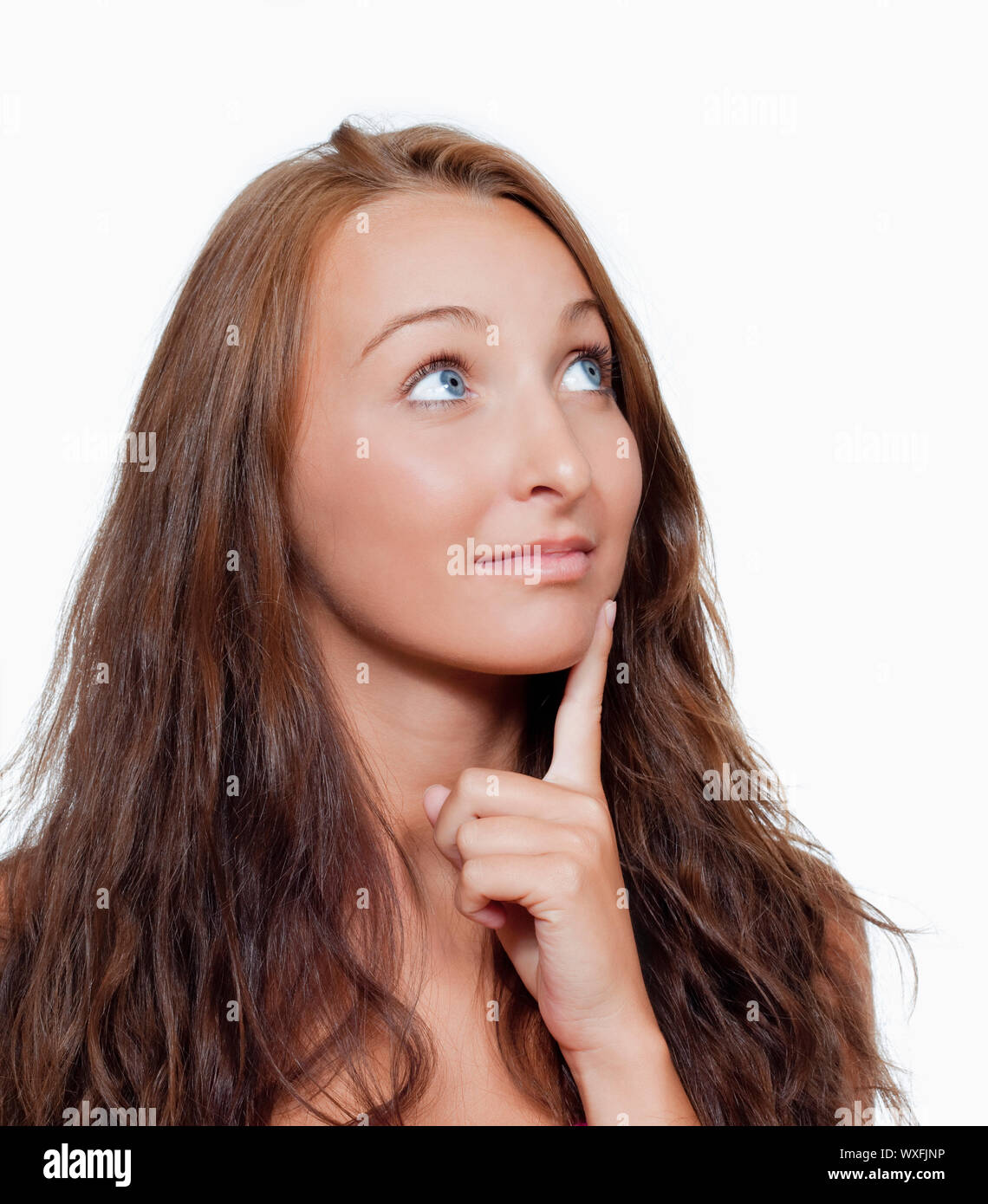 young girl looking up, thinking - isolated on white Stock Photo - Alamy