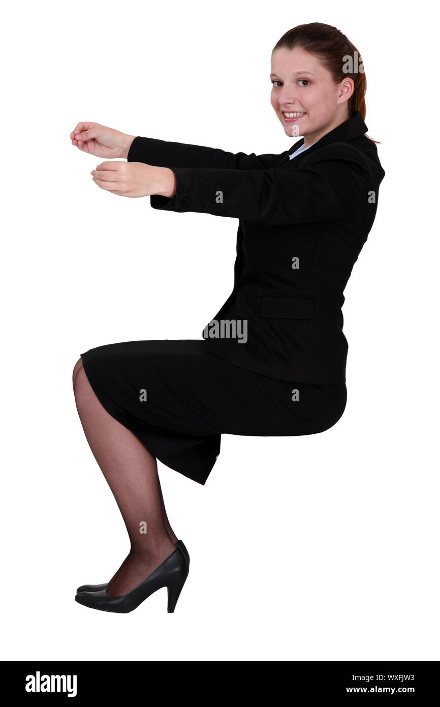 Businesswoman holding an invisible object Stock Photo - Alamy