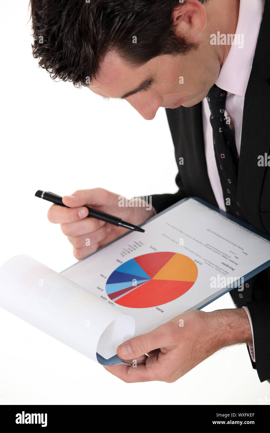 Man interpreting graph Stock Photo - Alamy