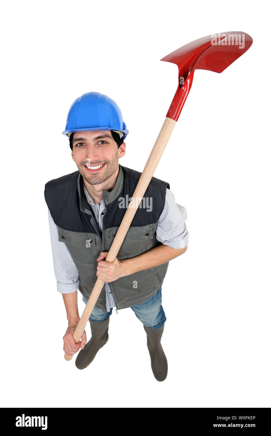Worker with shovel Stock Photo - Alamy