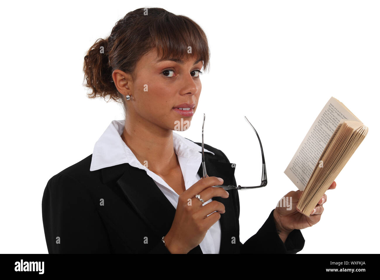 Businesswoman reading book Stock Photo - Alamy