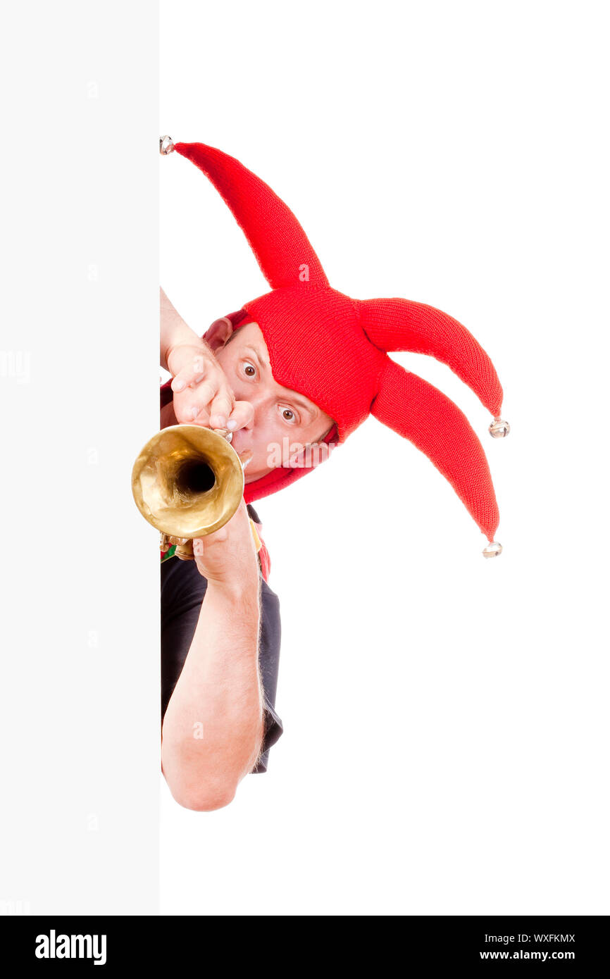 jester - entertaining figure in typical costume blowing trumpet Stock ...