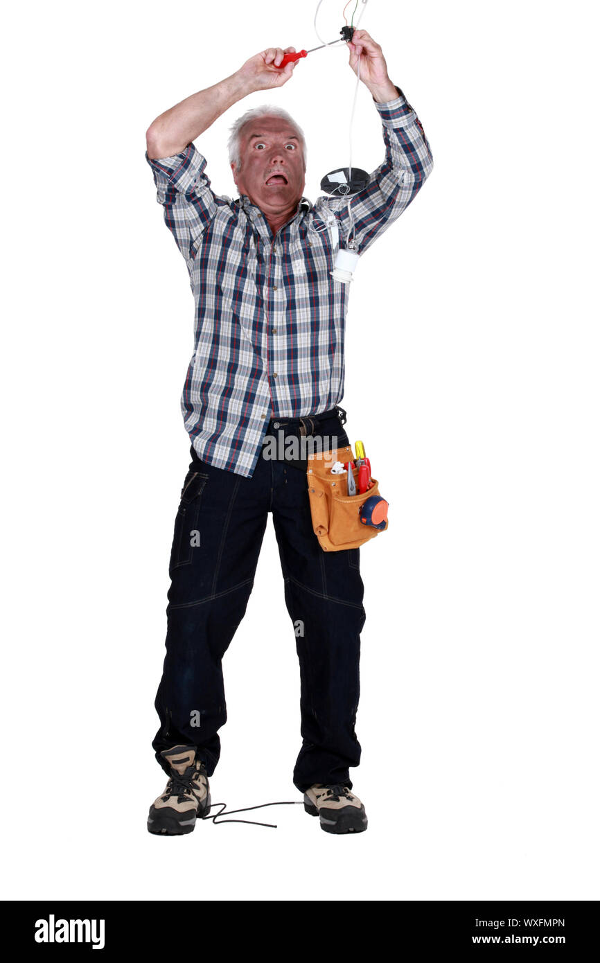 Man getting an electrical shock Stock Photo - Alamy