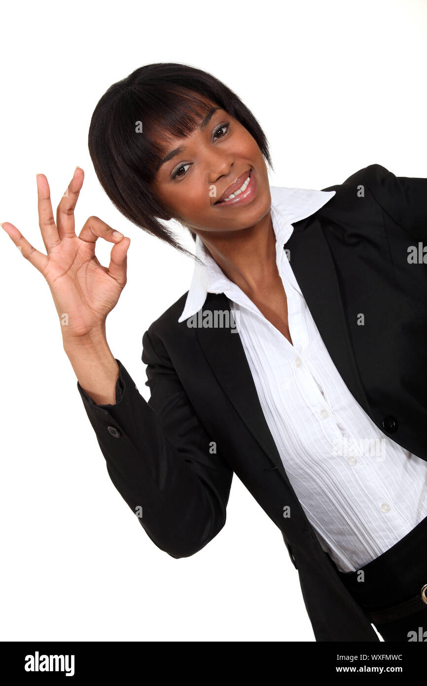 Afro-American businesswoman making an OK sign Stock Photo - Alamy