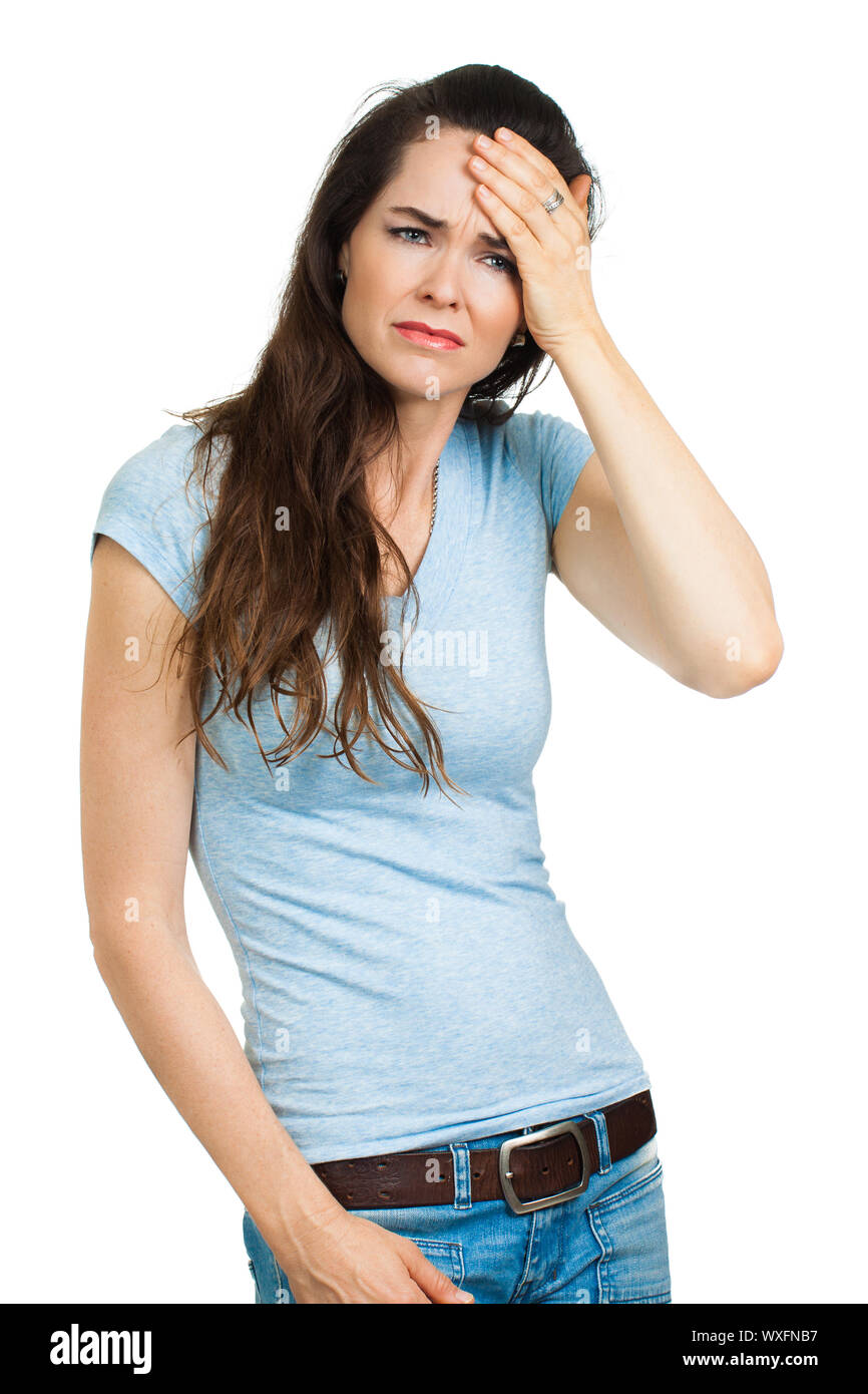 A woman suffering from a bad migraine or headache . Isolated on white ...