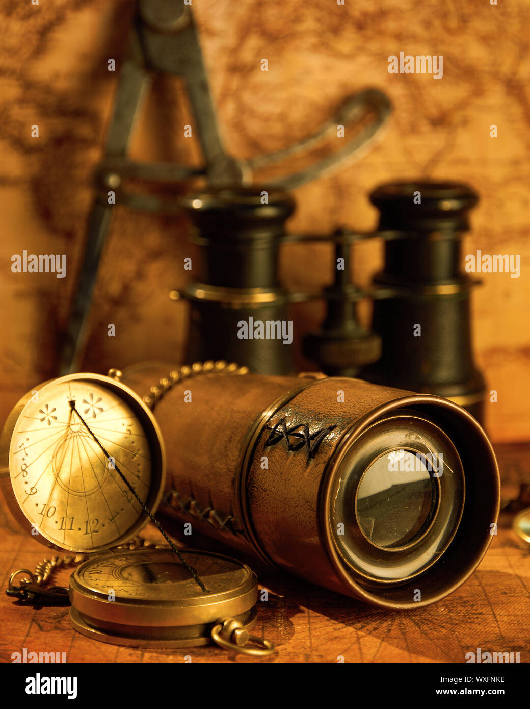 Old telescope with binoculars on map background Stock Photo - Alamy