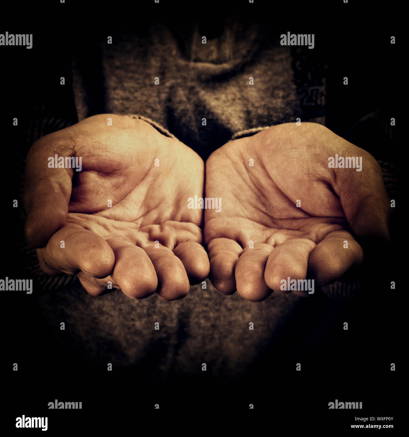 High contrast image of a person begging Stock Photo - Alamy