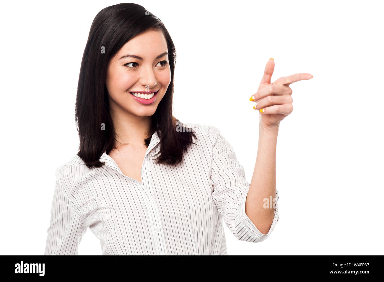 Cheerful young lady pointing away hi-res stock photography and images ...