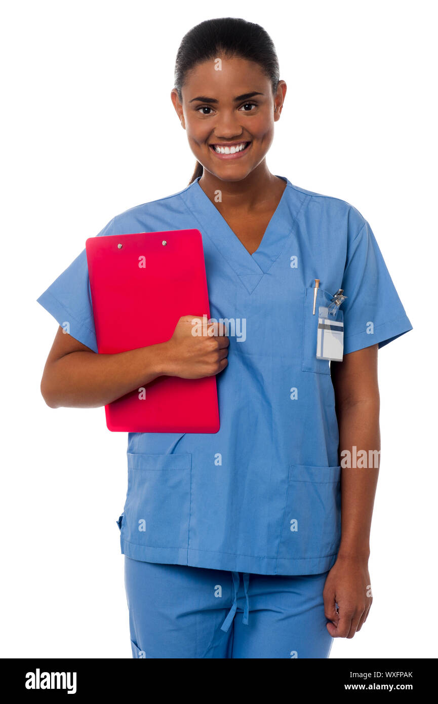 Charming young african nurse posing with red clipboard, medical uniform ...