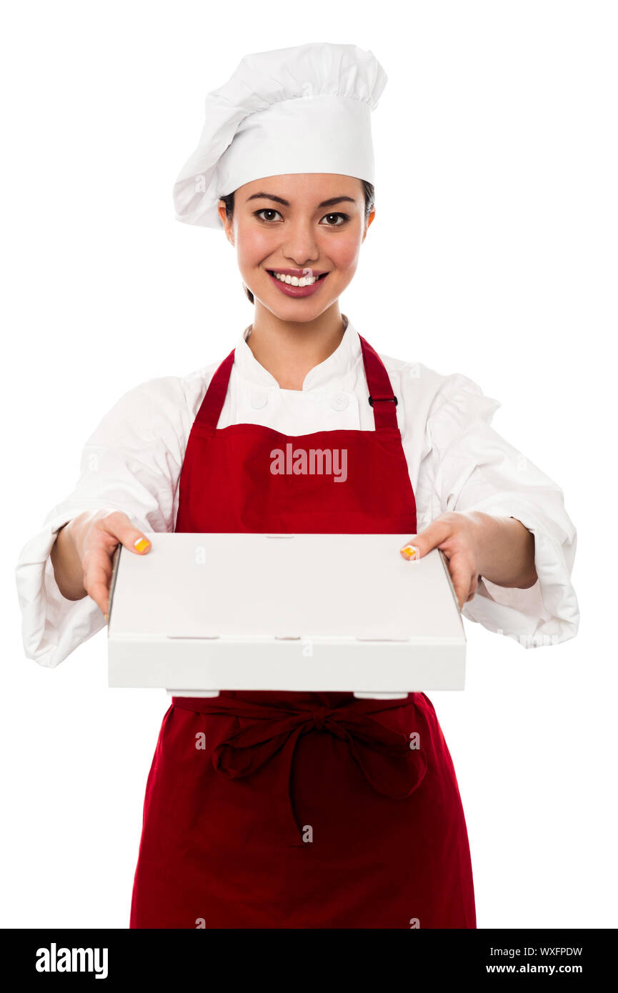 Young female chef delivering pizza Stock Photo - Alamy