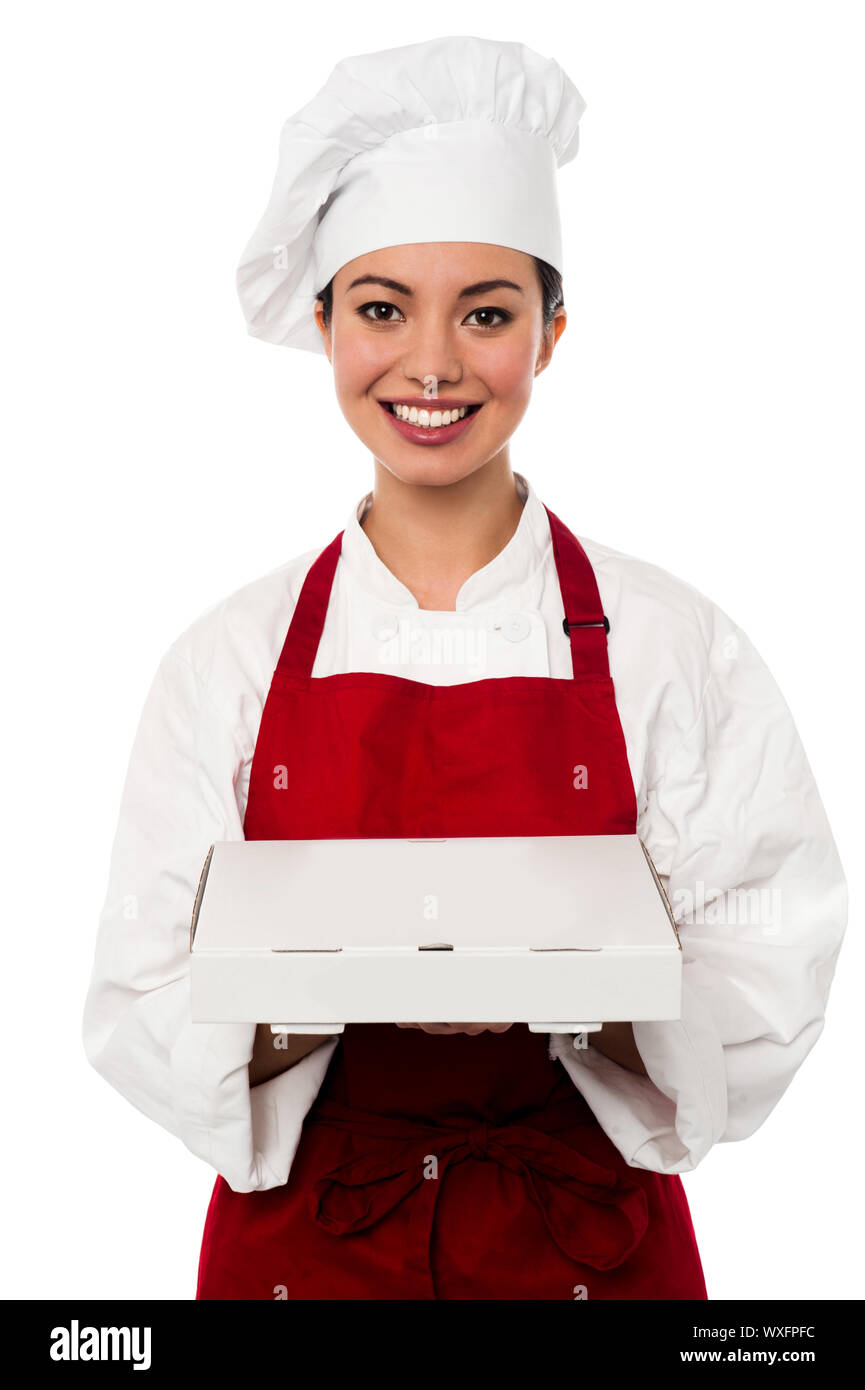 Young female chef delivering pizza Stock Photo - Alamy