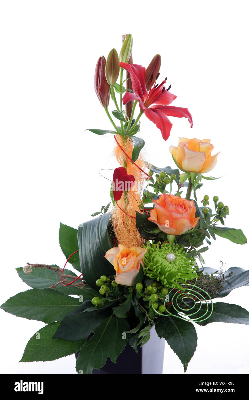 Formal floral wedding arrangement with colourful flowers including ...