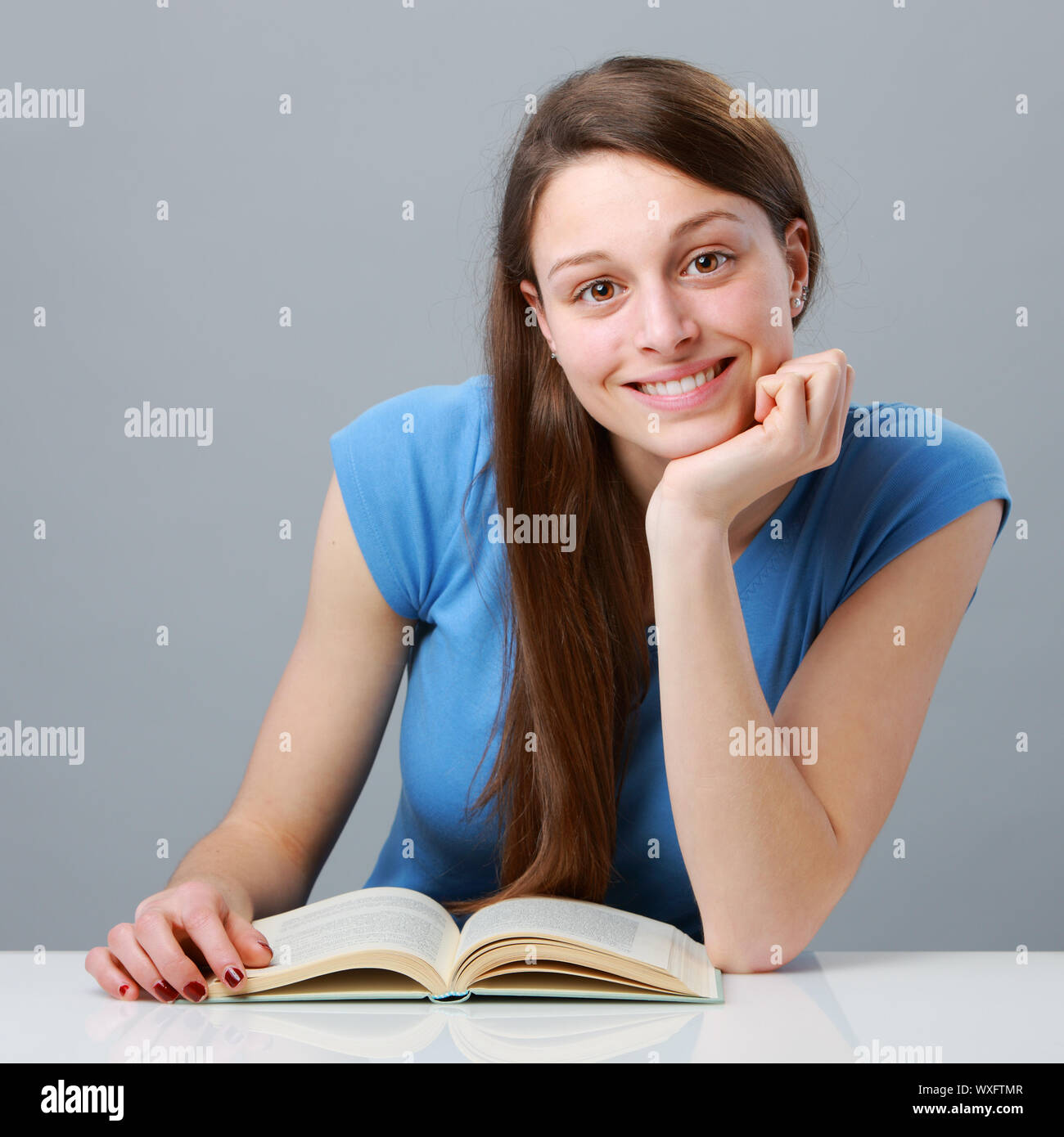 Female young student with book Stock Photo - Alamy