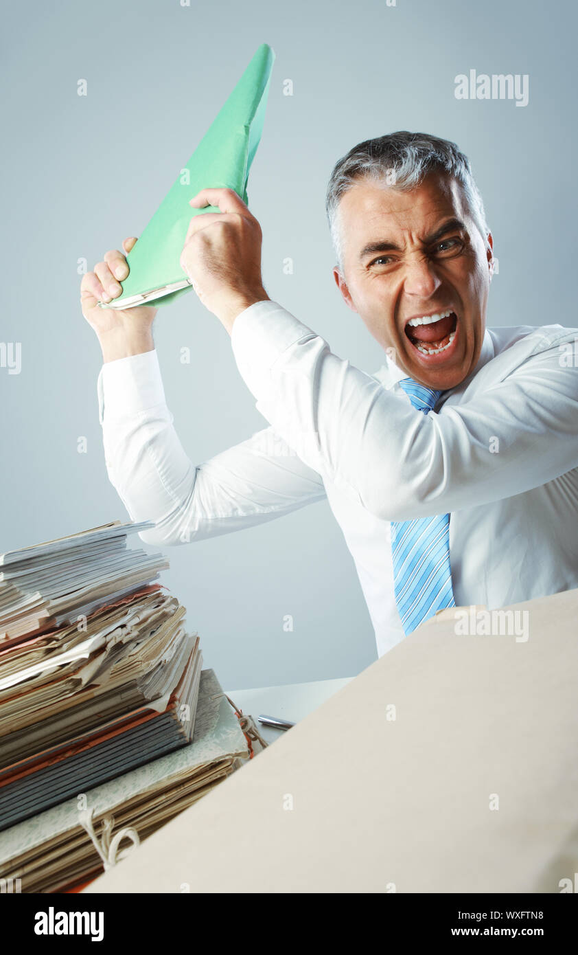 Overworked mature business man screaming in anger Stock Photo - Alamy