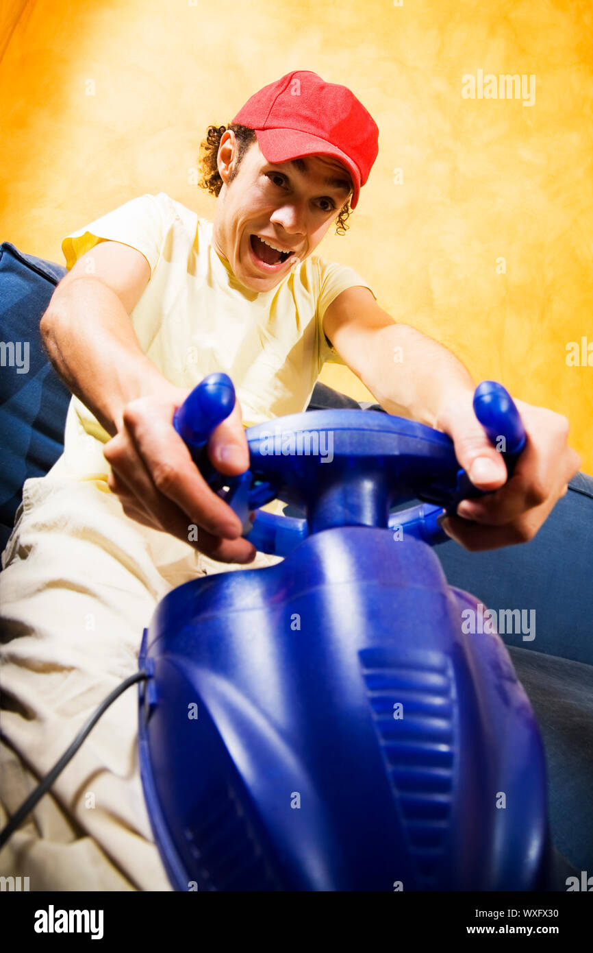 playing video games: guy having fun with his brand new videogame Stock ...