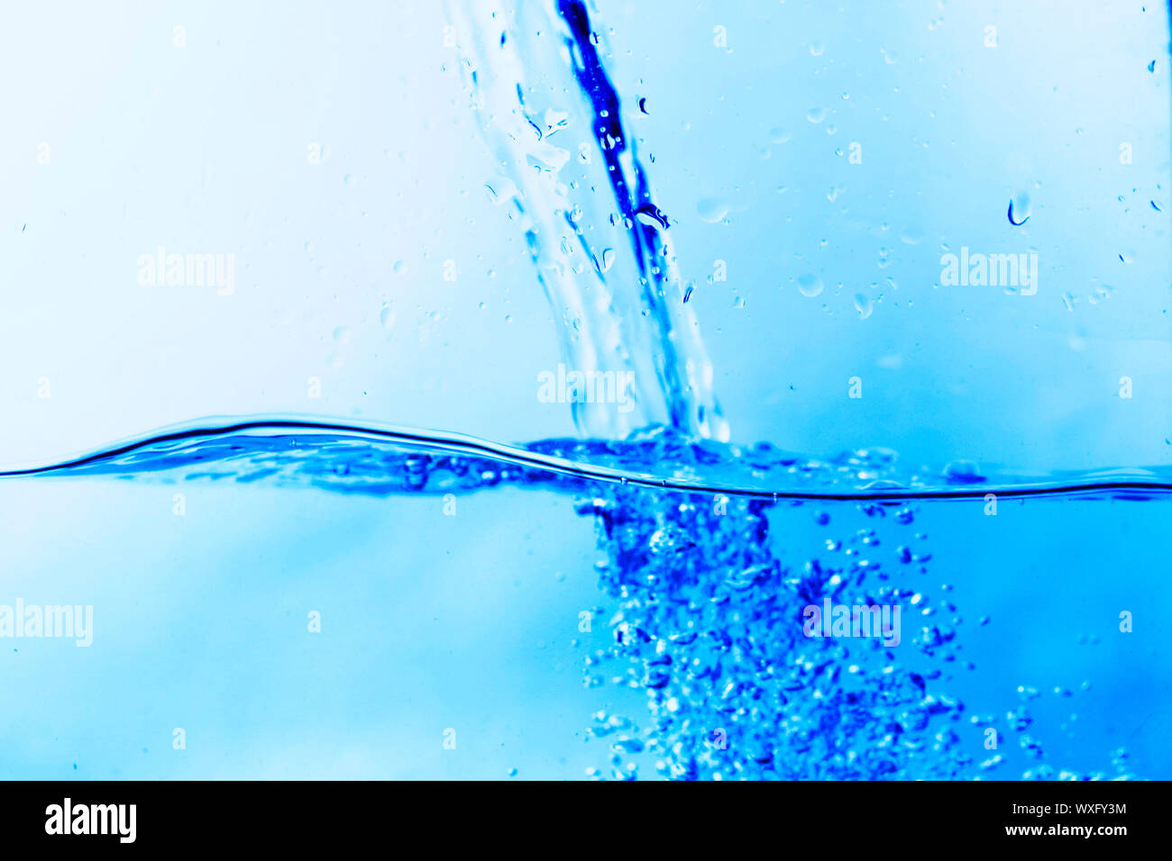 great blue water splash close up macro Stock Photo - Alamy