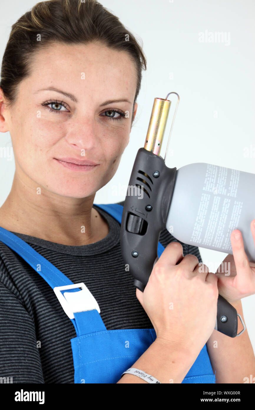 Woman with a blowtorch Stock Photo - Alamy