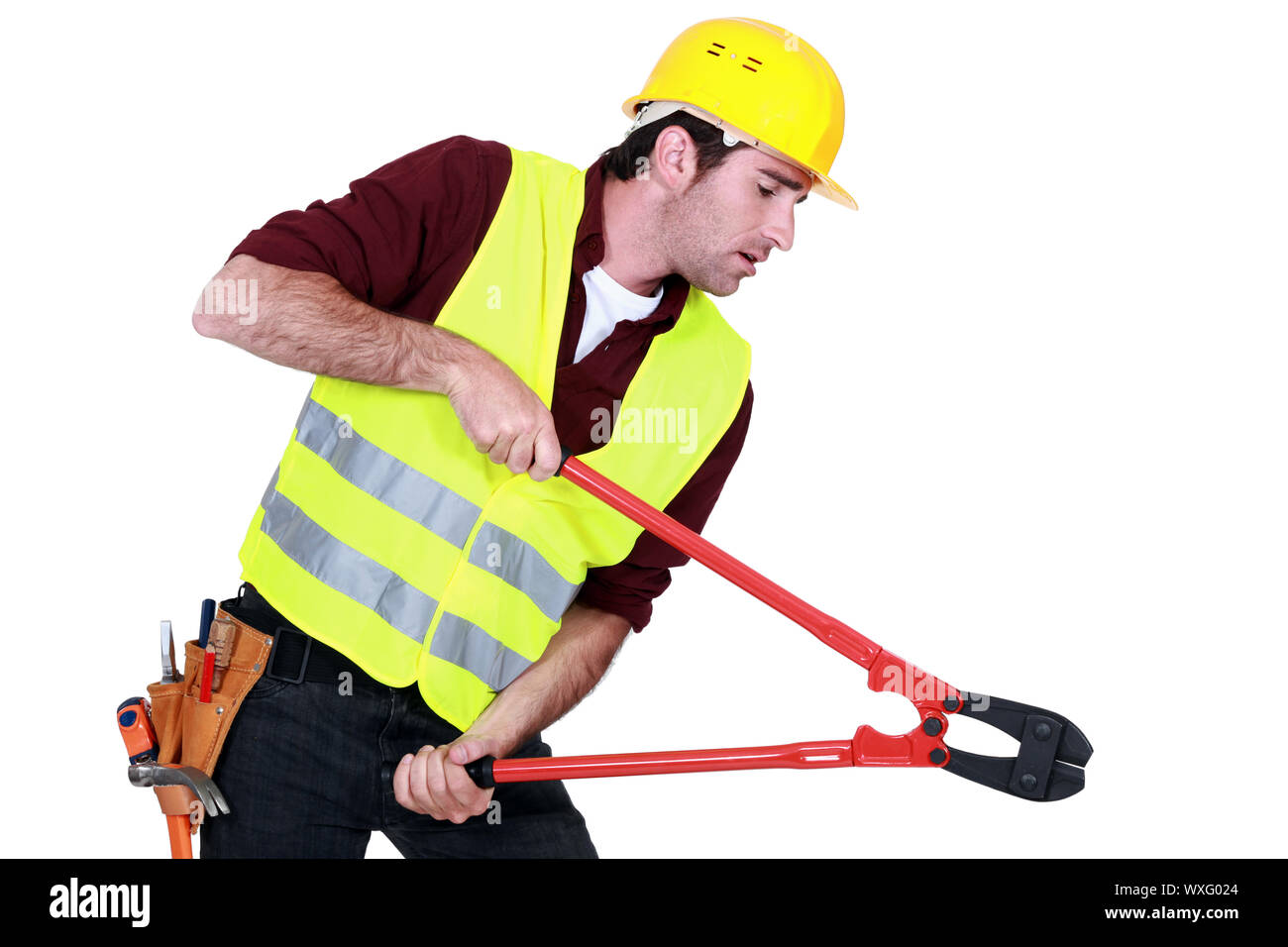 Tradesman using a pair of clippers Stock Photo - Alamy