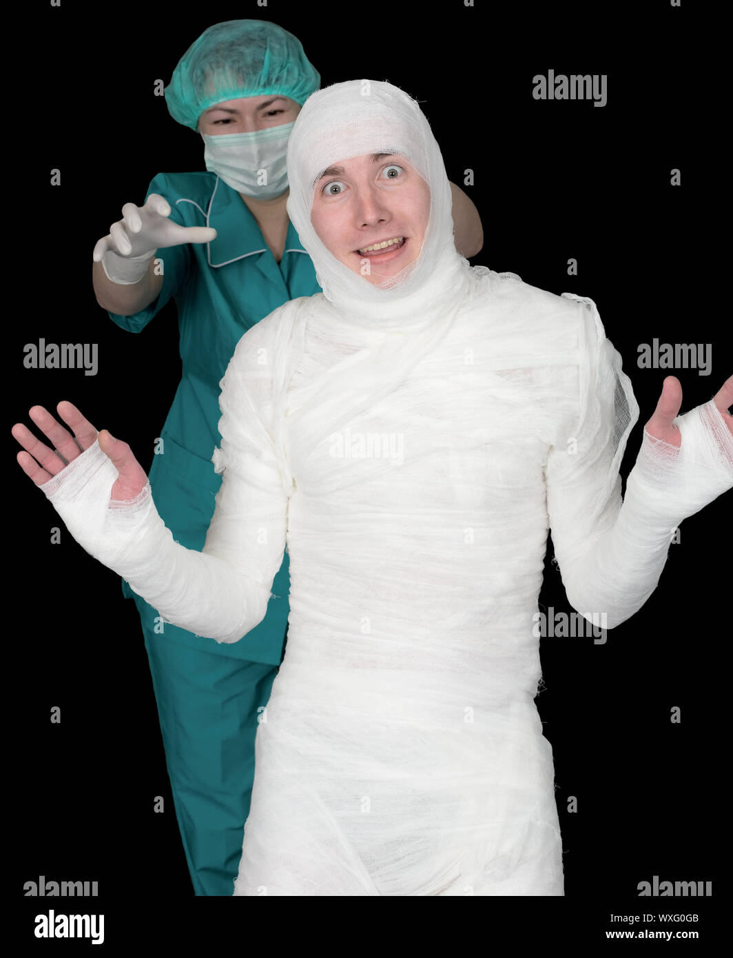 Man in bandage and nurse on black background Stock Photo - Alamy