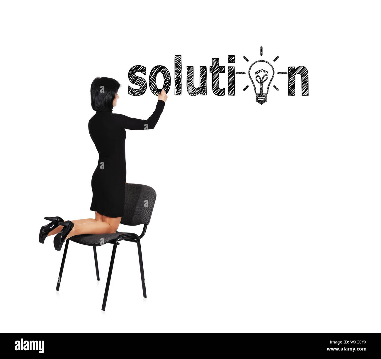 woman standing on a chair and drawing solution Stock Photo - Alamy