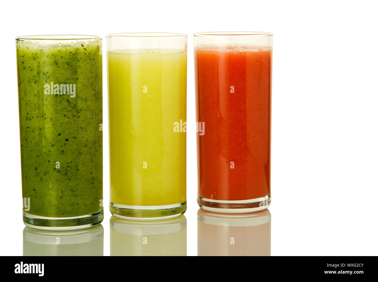 Fresh cocktail on isolate. Three glasses with vegetable cocktails ...