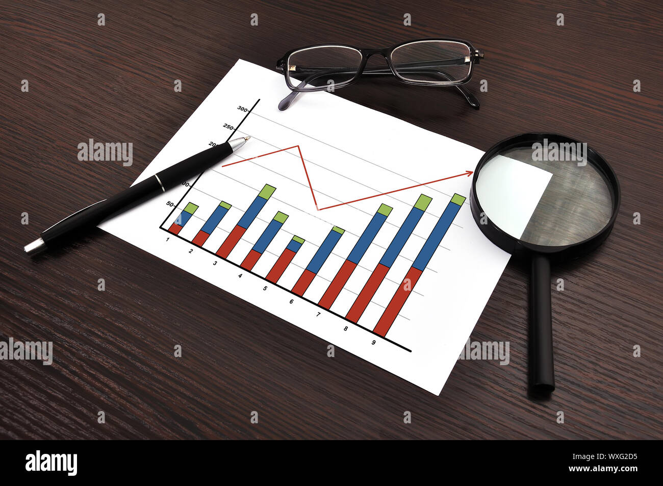 workplace with growth chart on paper Stock Photo - Alamy