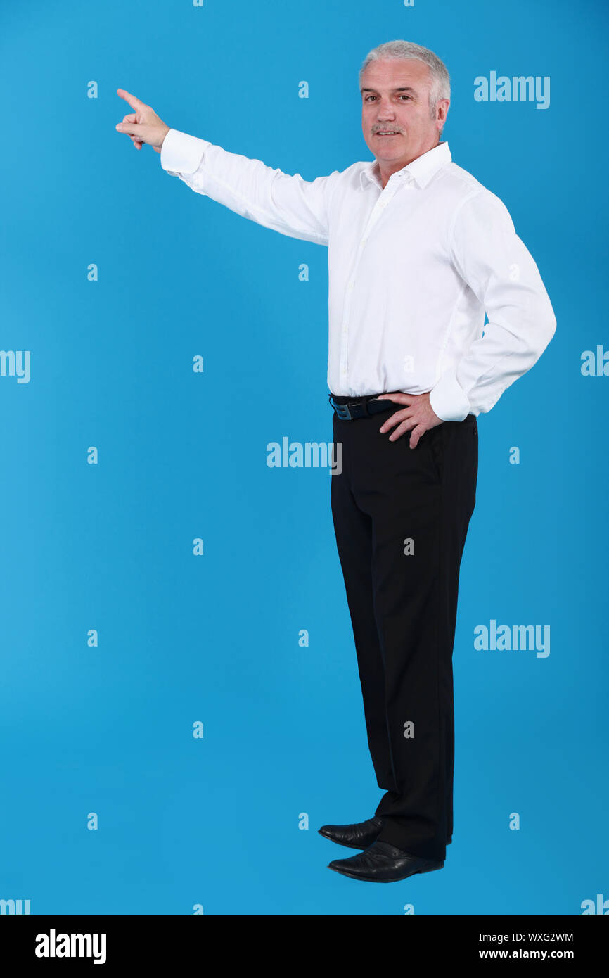 Man pointing to an invisible object Stock Photo - Alamy